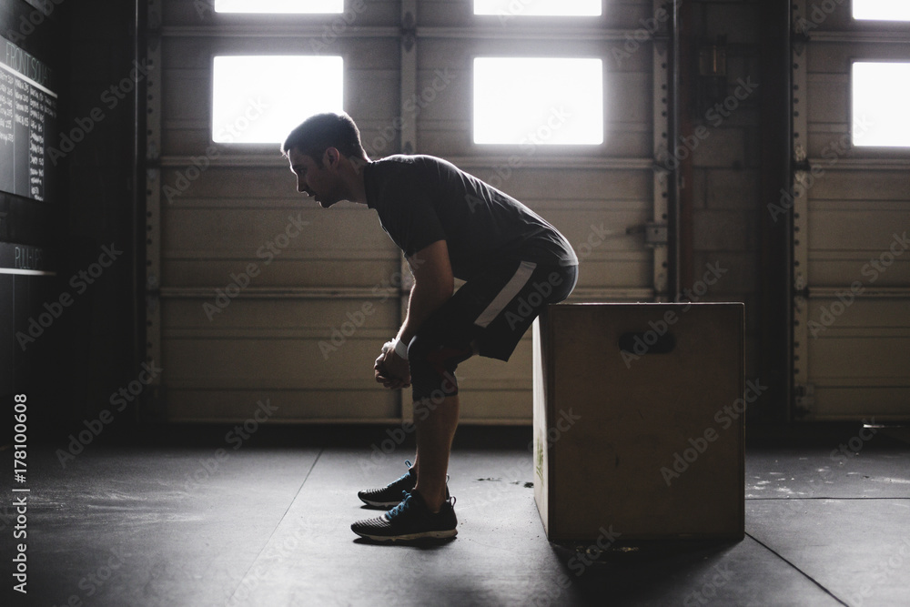 Portrait of young, fit and sweaty man recovering in gym Stock Photo ...