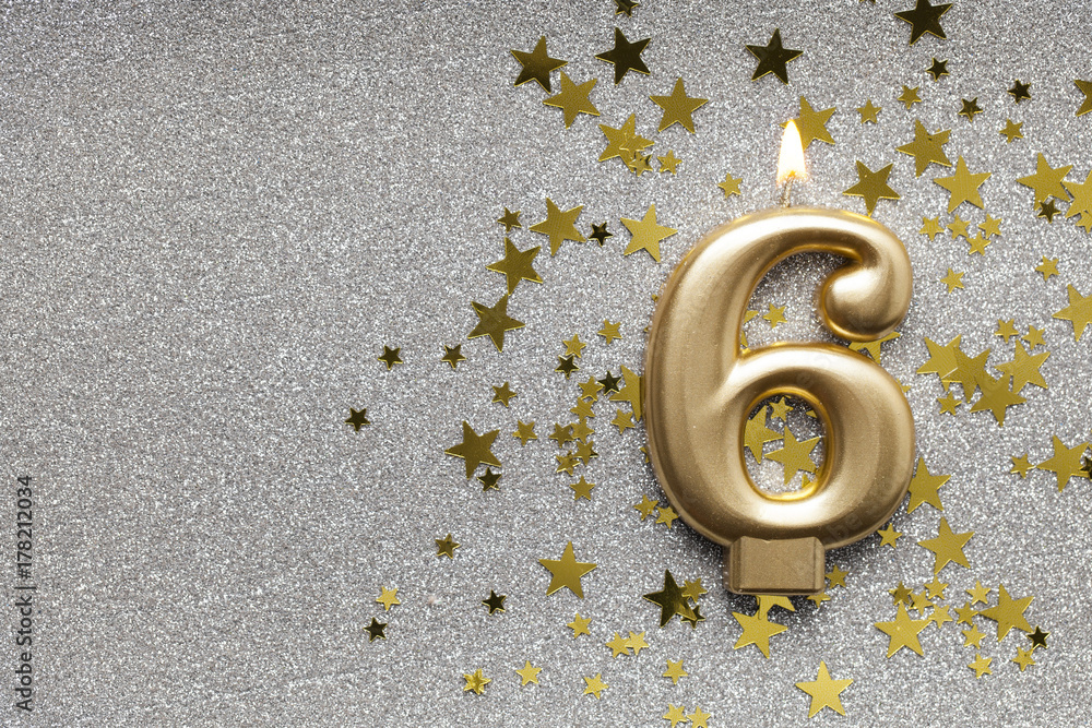 Number 6 gold celebration candle on star and glitter background Stock ...