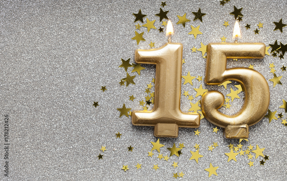 Number 15 gold celebration candle on star and glitter background Stock ...