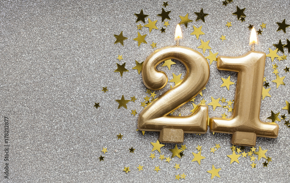 Number 21 gold celebration candle on star and glitter background Stock ...