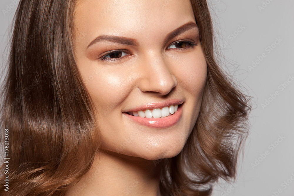 Beautiful young woman with long brown hair and white smile. Stock Photo ...