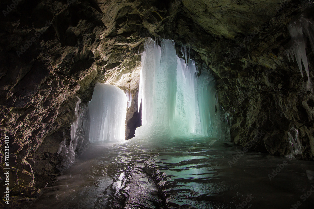 Underground mine shaft tunnel gallery witn ice frozen stalactites ...