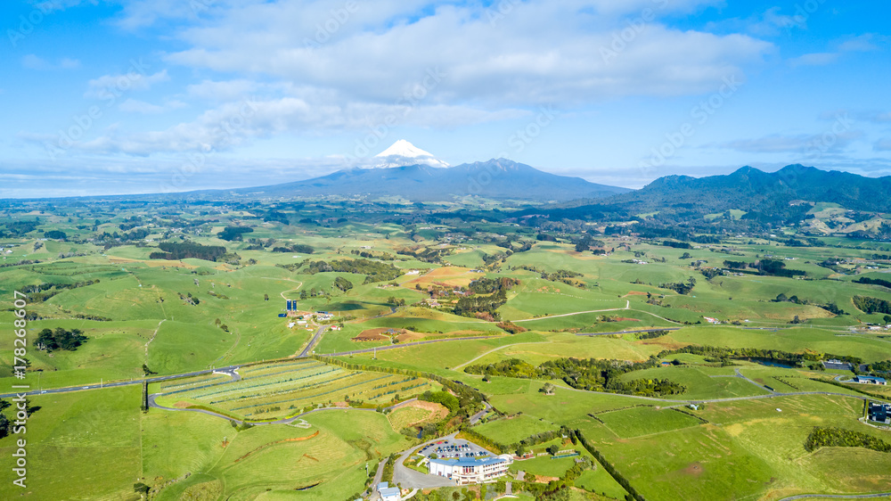Aerial view on a vineyard and small farms at the foot of Mount Taranaki ...