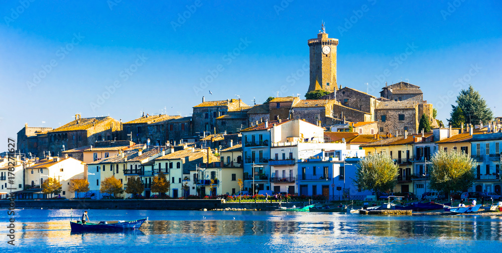 Scenic lake Bolsena (lago di Bolsena) with view of medieval fishing ...
