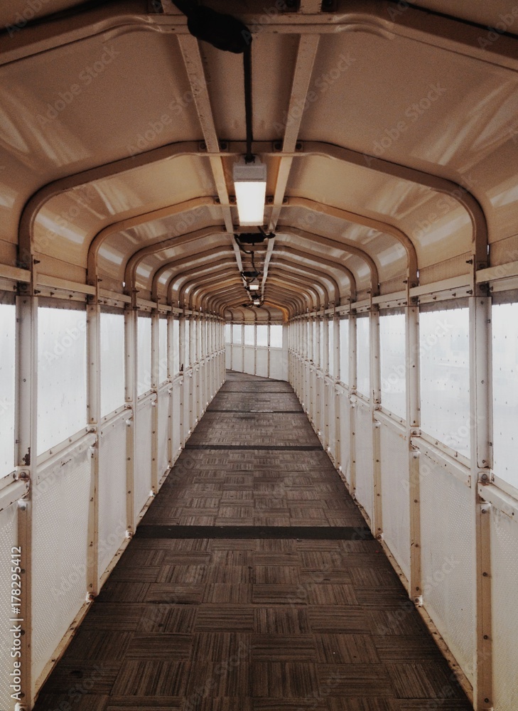Outdoor airport walkway leading to plane Stock Photo | Adobe Stock