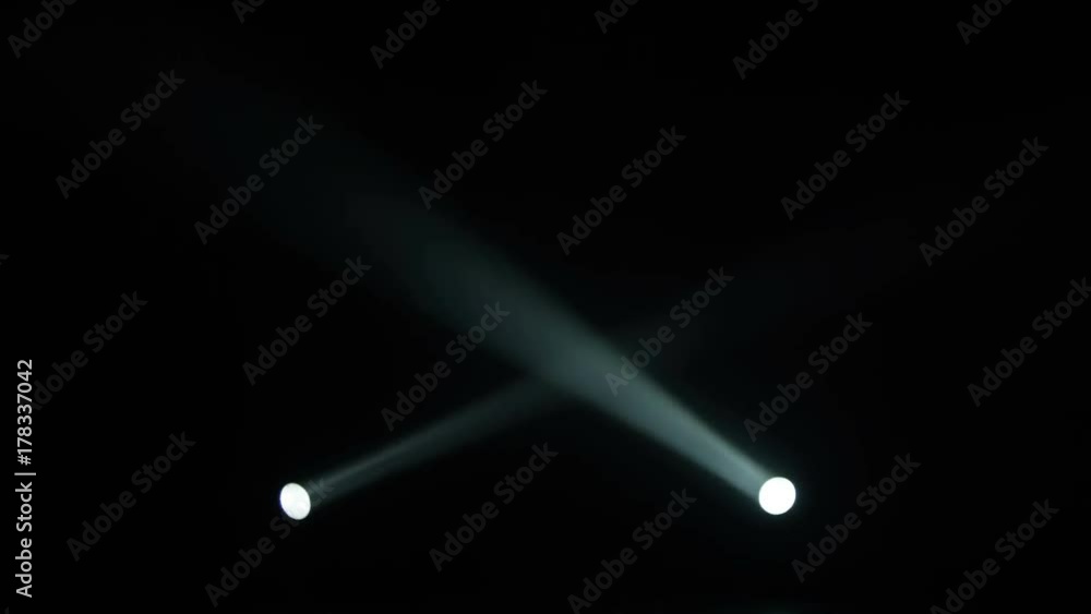 Realistic footage of stage light flashing rays spotlights through smoke ...