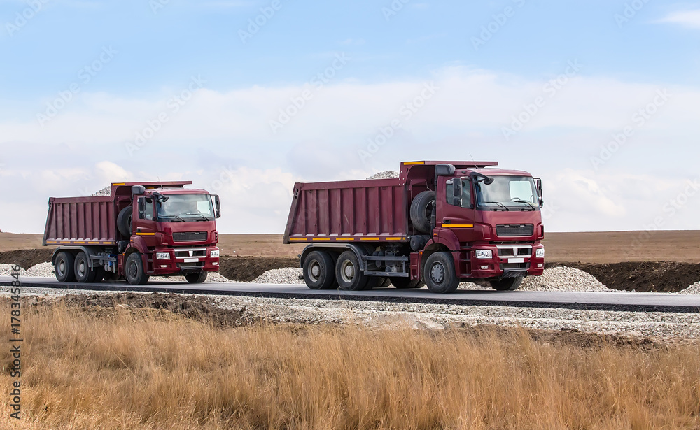 Dump trucks with gravel Stock Photo | Adobe Stock