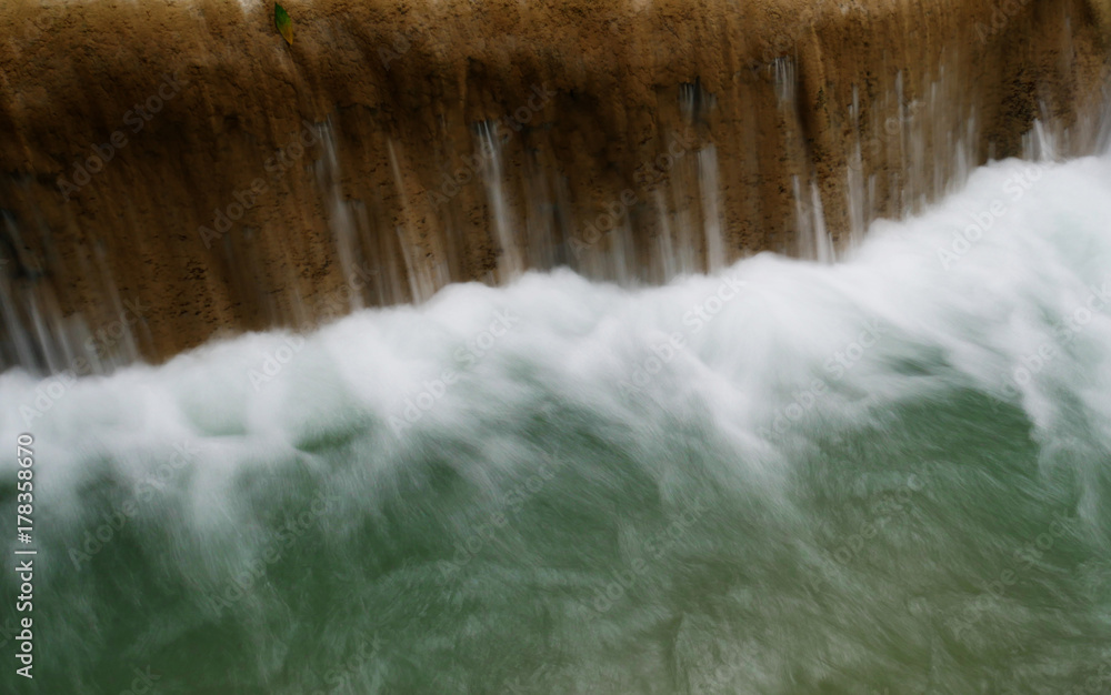 Clear water flow of the Tad Sae waterfall in Luang Prabang, Laos. Long ...