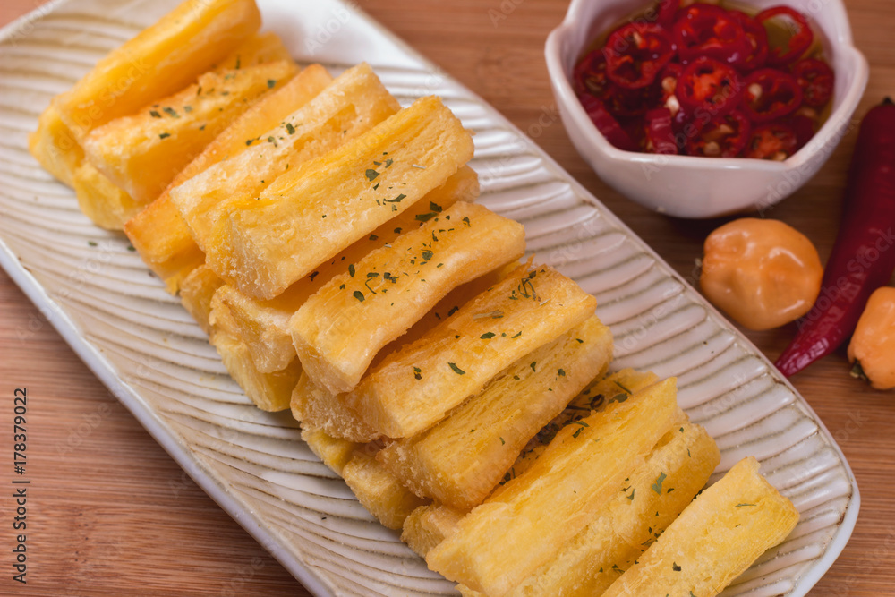 Photo & Art Print Deep fried cassava root. Brazilian food mandioca ...