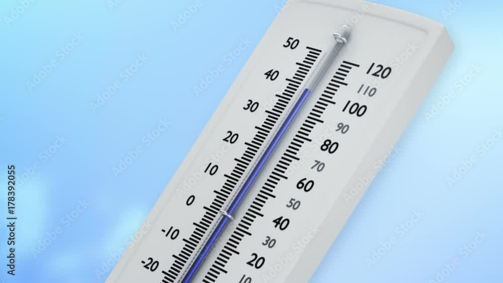Close up at decreasing temperature on thermometer with blue mercury ...