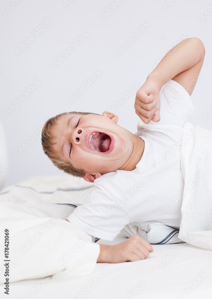 Boy Yawning And Stretching