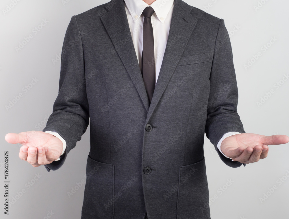 Young man giving empty hand on black background.Hands open businessman ...