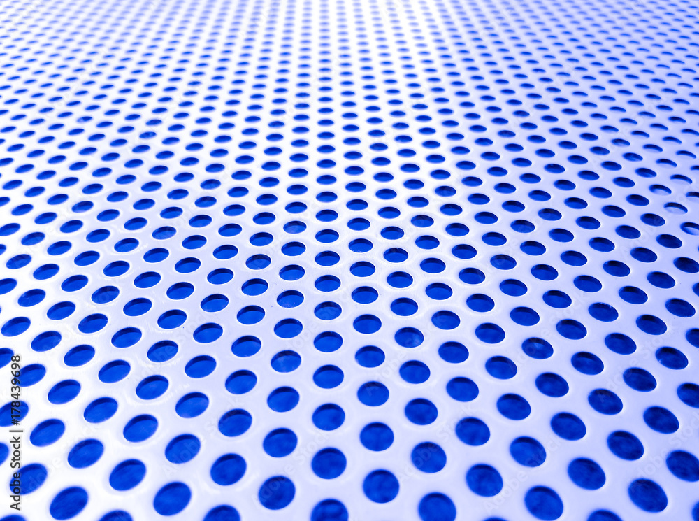 Blue perforated sheet, blue steel perforated plate in the background ...