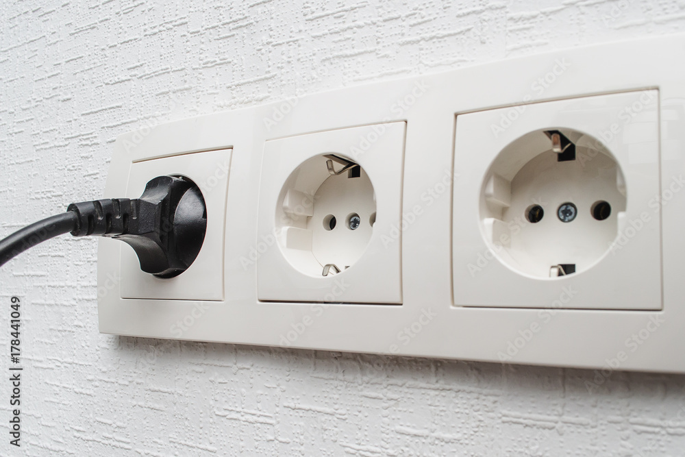 European set outlet on the wall with the plug inserted Stock-Foto ...