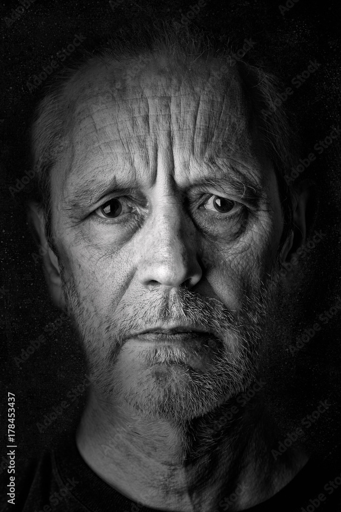 Portrait of a serious and angry man with a penetrating gaze and fury in ...