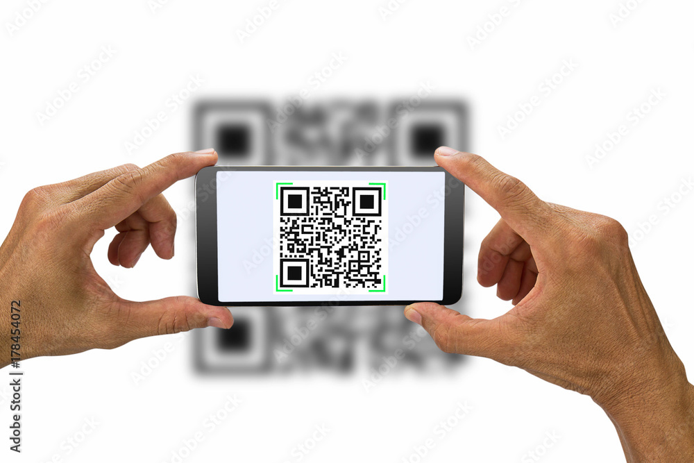 Hands holding smartphone scanning QR code on white background, business ...