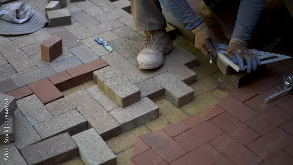 Marking a brick for cuts for a custom designed and cut brick pattern as ...