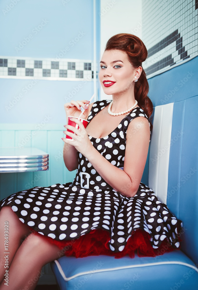 Retro (vintage) portrait of cheerful beautiful young girl sitting in ...