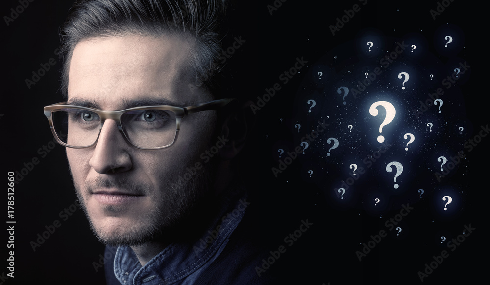 man with many question mark near him Stock Photo | Adobe Stock