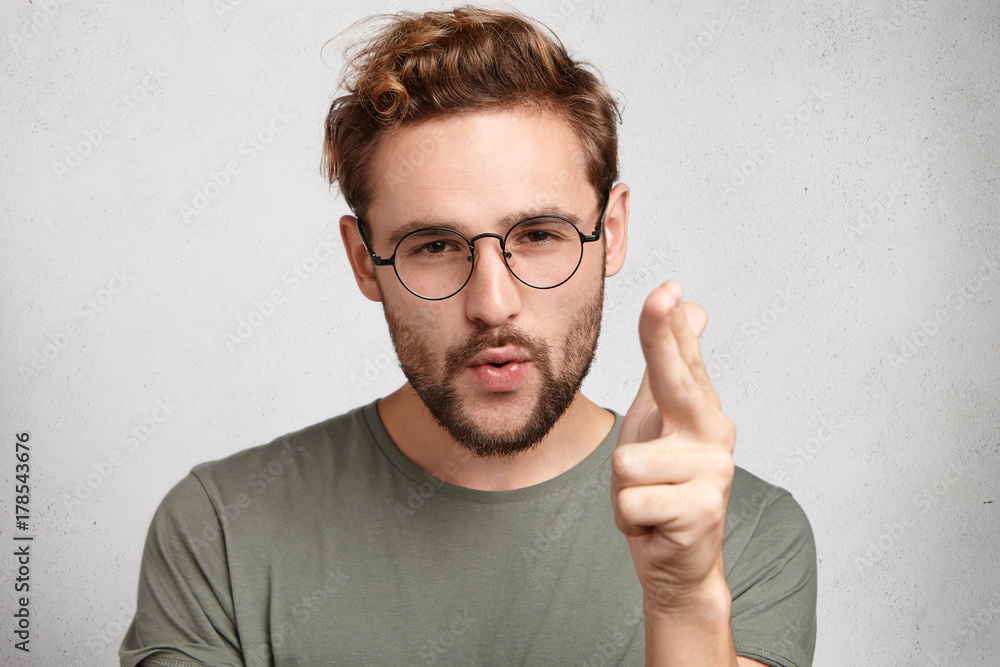 Confident businessman makes shooting gesture, recieves great success ...