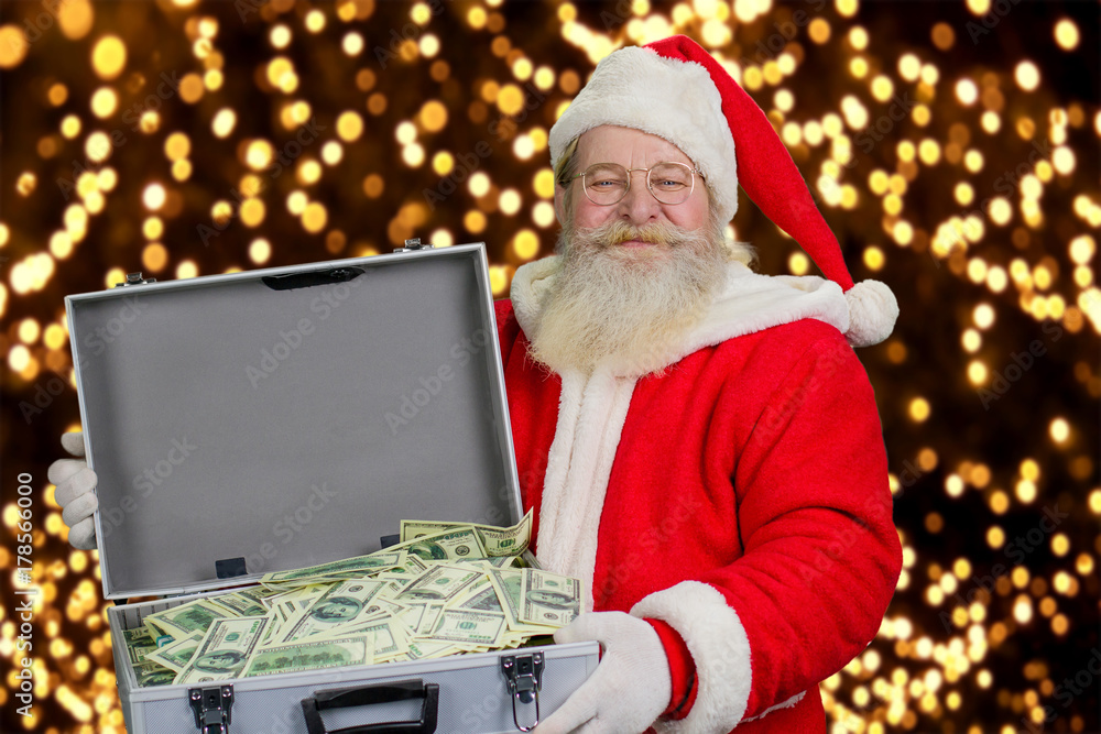 Santa Claus holding case with money. Authentic Santa Claus with open ...