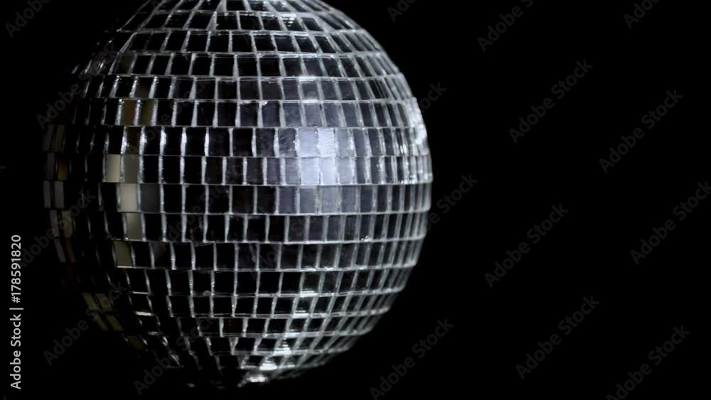 Disco mirror ball at black background with copyspace to the right with ...