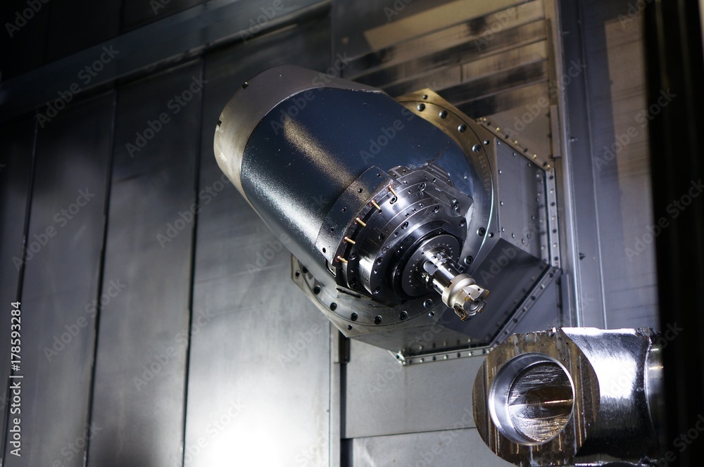 The CNC lathe machine or Turning machine drilling the metal rod with ...