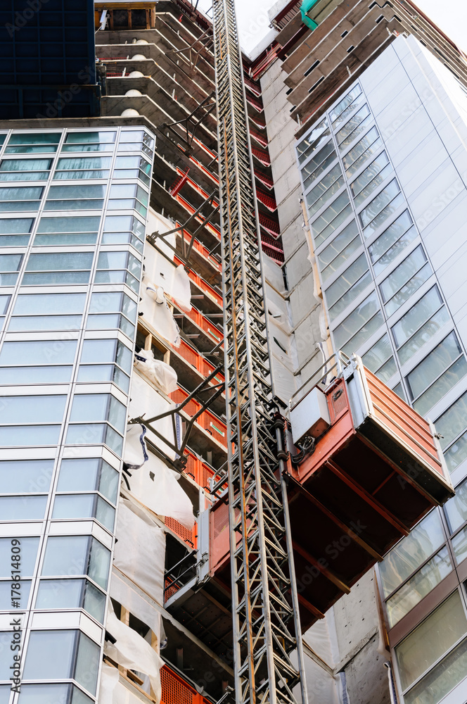 Elevator for lifting building material at a building site. Stock Photo ...