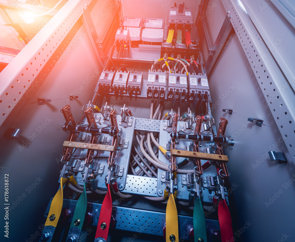 Wires and switches in electric box. Electrical panel with fuses and ...