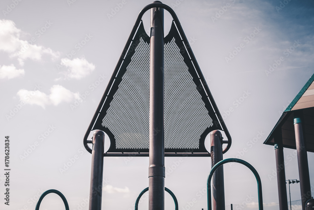 Abstract image of children's outdoor play equipment. Cloud and sky ...