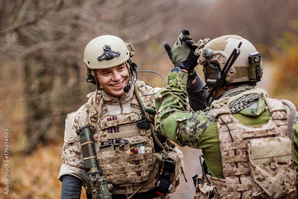 soldiers holding gps in hand and determines the location of coordinates ...