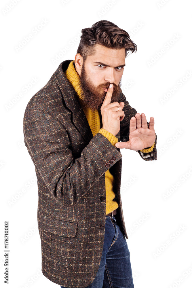 man making a shushing gesture raising his finger to his lips. emotions ...