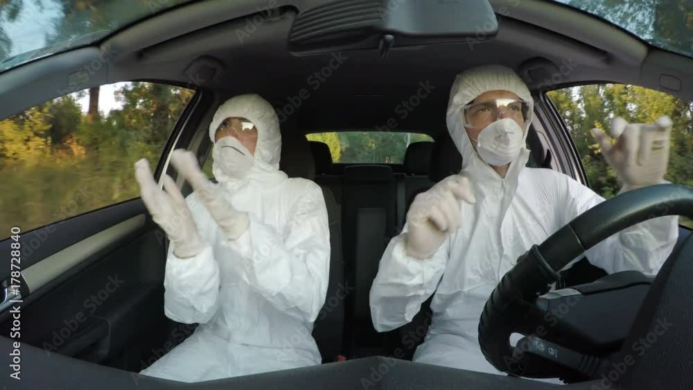 Cheering scientists in hazmat suit dancing and having fun at work in ...