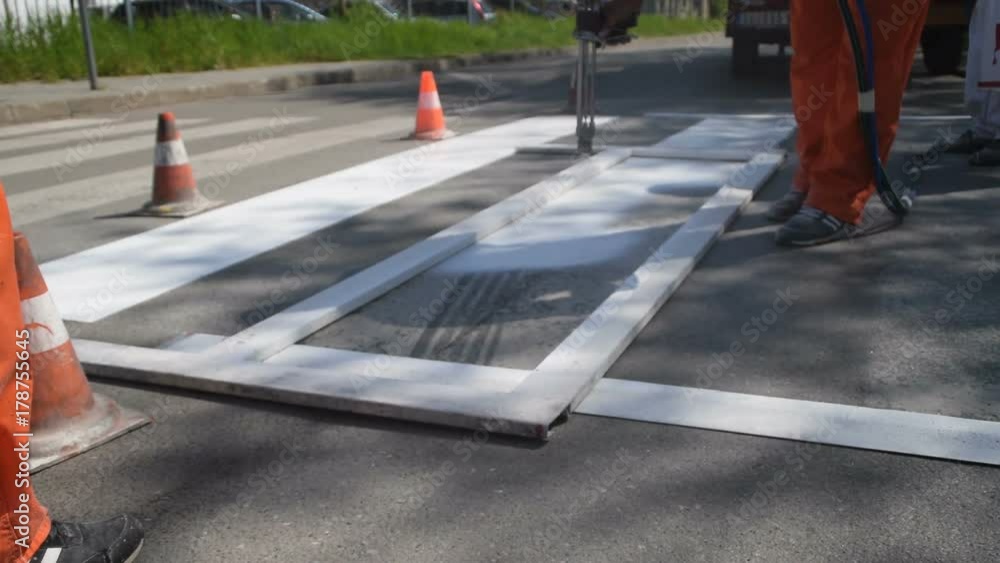 Painting the pedestrian crossing, repairing the road and painting lines ...