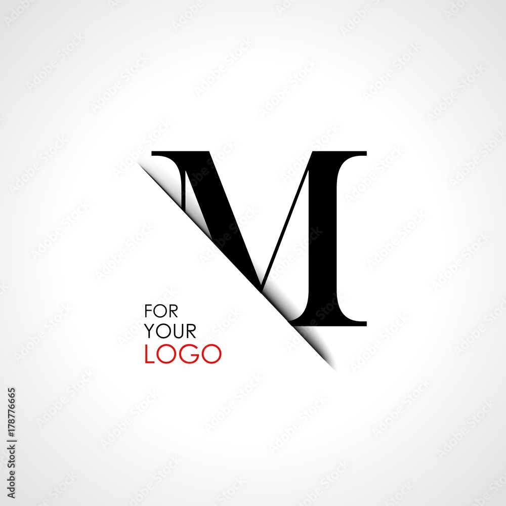 Capital m letter is inserted in the paper slot. To create logos ...