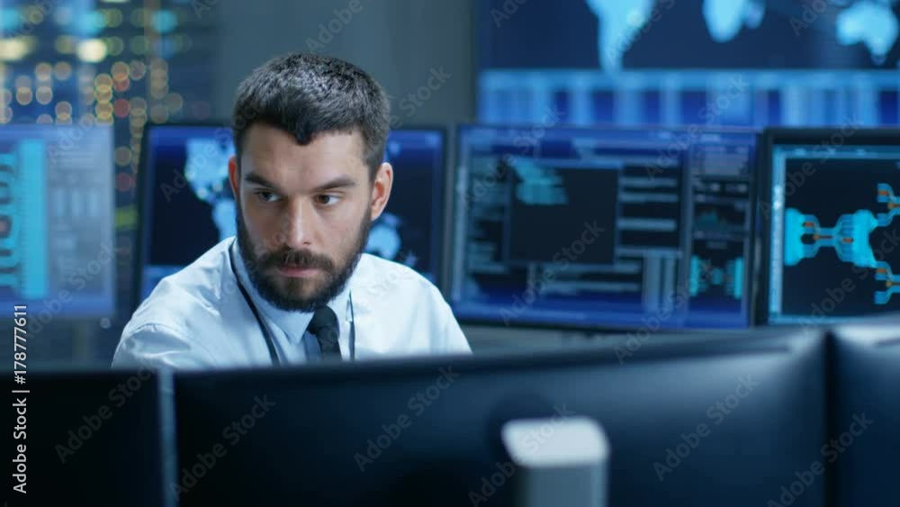 In the Monitoring Room Technical Operator Attentively Monitors ...