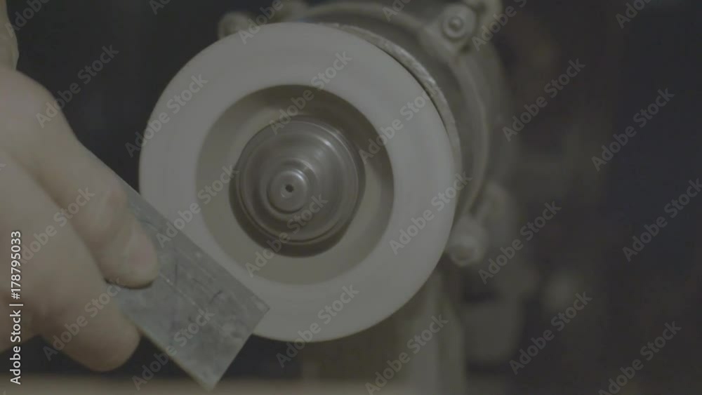 The worker sharpens the tool. Work on a sharpening machine. Stock Video ...
