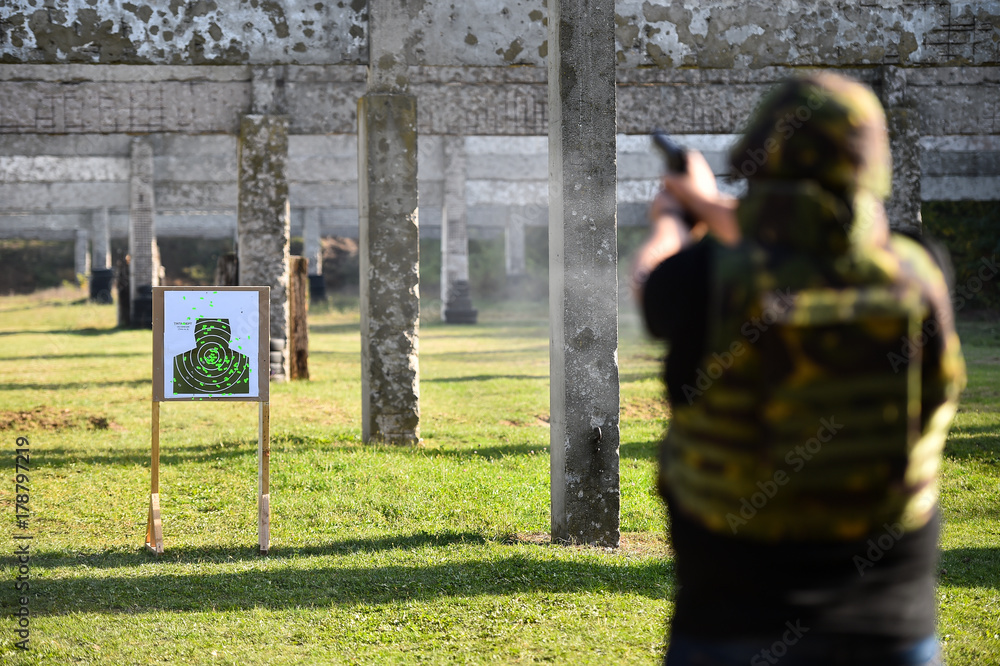 Photo & Art Print Outdoor shooting with a 9mm pistol in a shooting ...