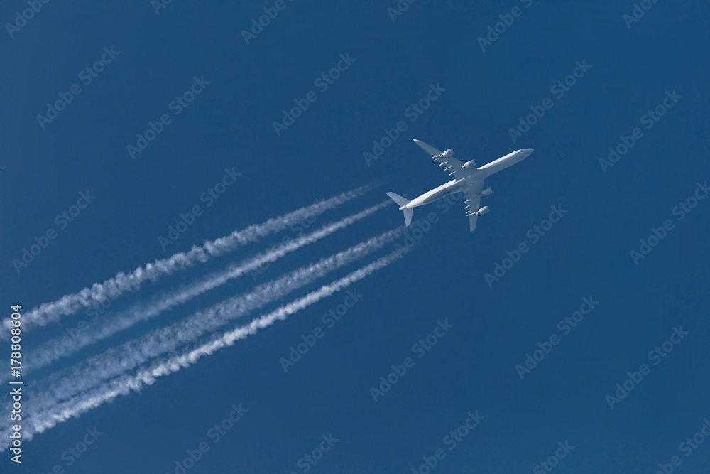 Plane at cruising altitude Stock Photo | Adobe Stock