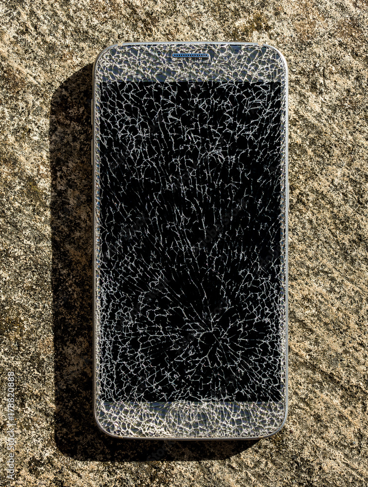 Top view and close-up image of old broken and cracked screen smartphone ...