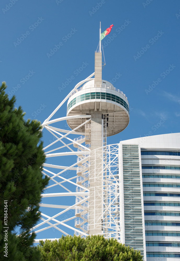 Vasco da Gama Tower with Portugal flag. Stock 写真 | Adobe Stock