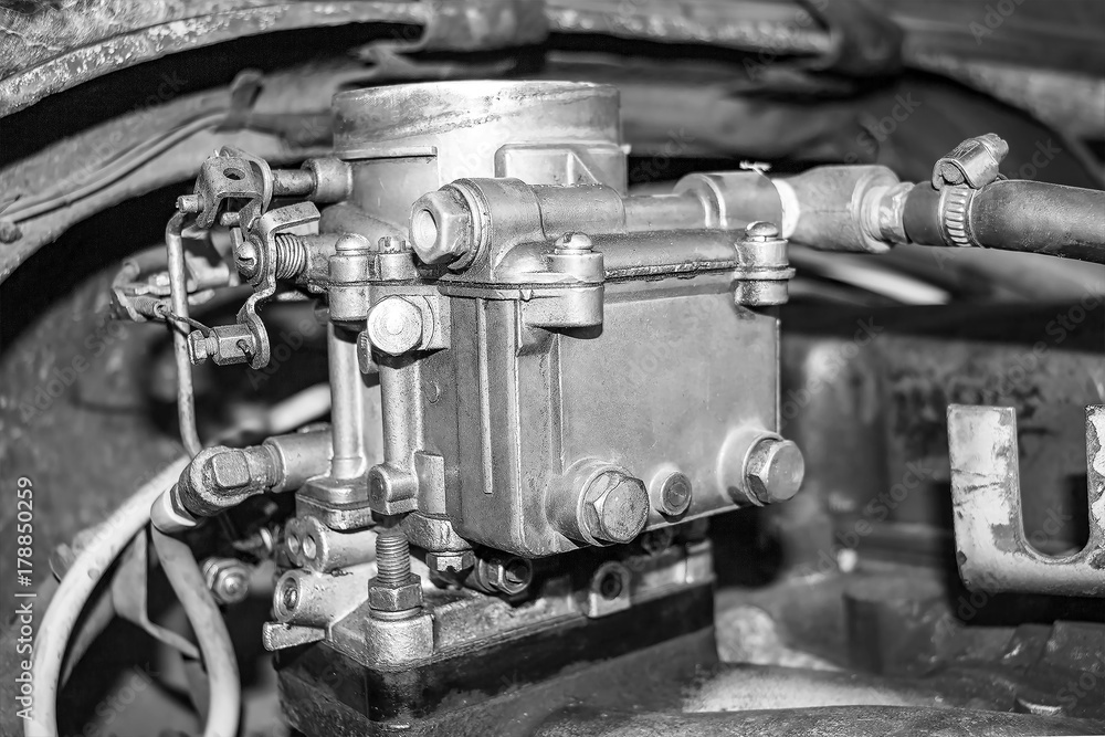 Old carburetor on an Vintage car engine. Black and white photo Stock ...
