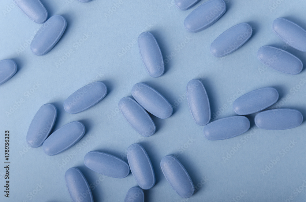 random composition of blue tablets over a light blue background for ...