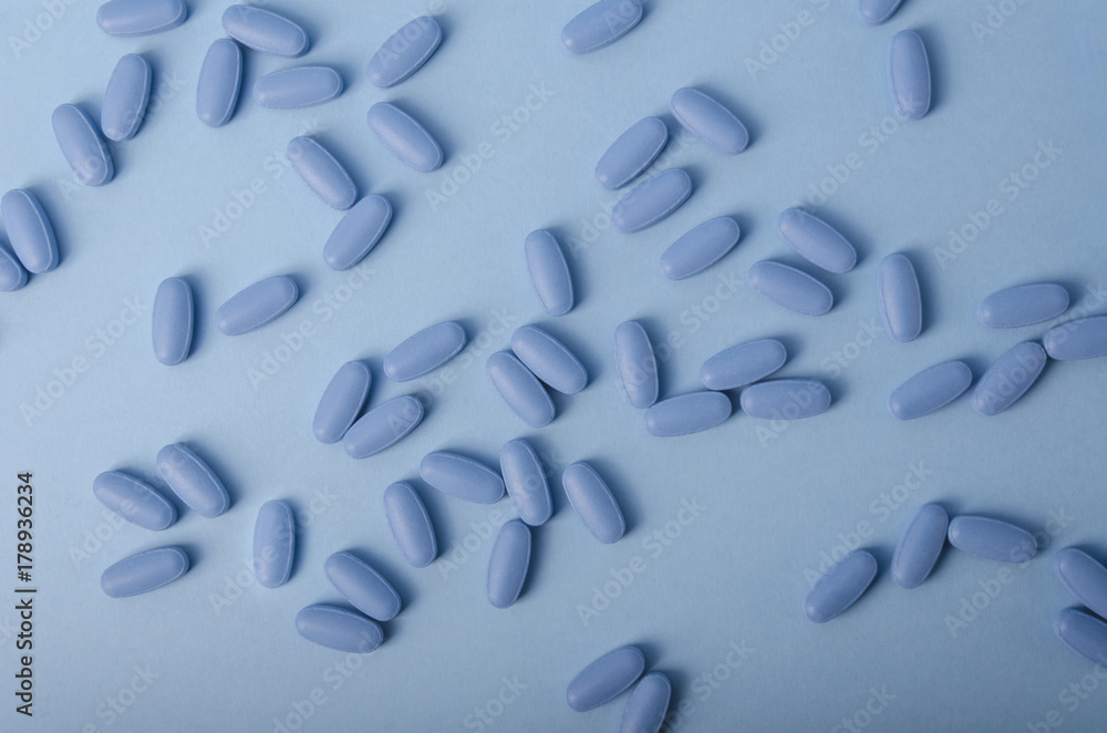 random composition of blue tablets over a light blue background for ...