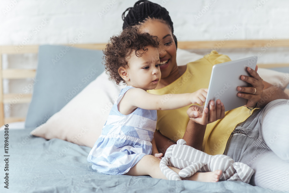 Mother and Child Using Tablet Stock Photo | Adobe Stock