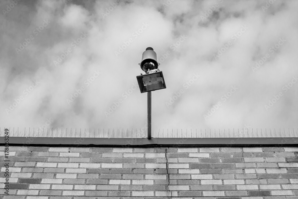 Isolated external lamp. Halogen lamp on exterior of building facade ...