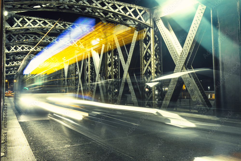 Asphalt road under the steel construction of a bridge in the city ...