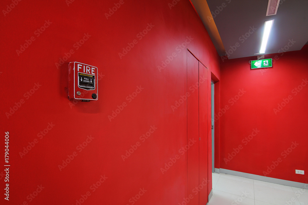 Emergency exit of the building with fire exit sign and fire alarm Stock ...