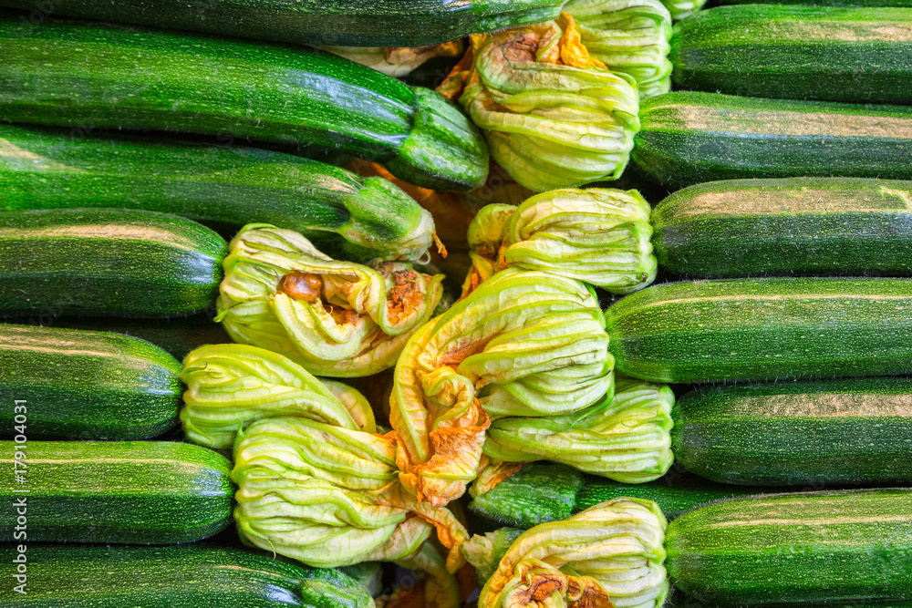Zucchini for food background. Green zucchini in a box close up ...