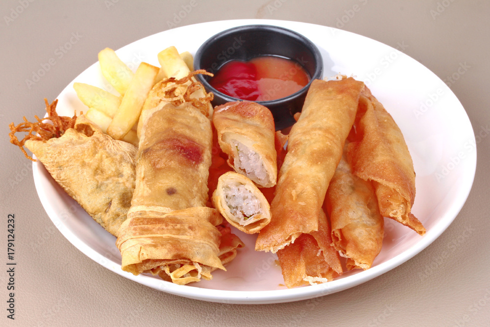 Deep fried spring roll,and frence fries sreved with tomato souce and ...
